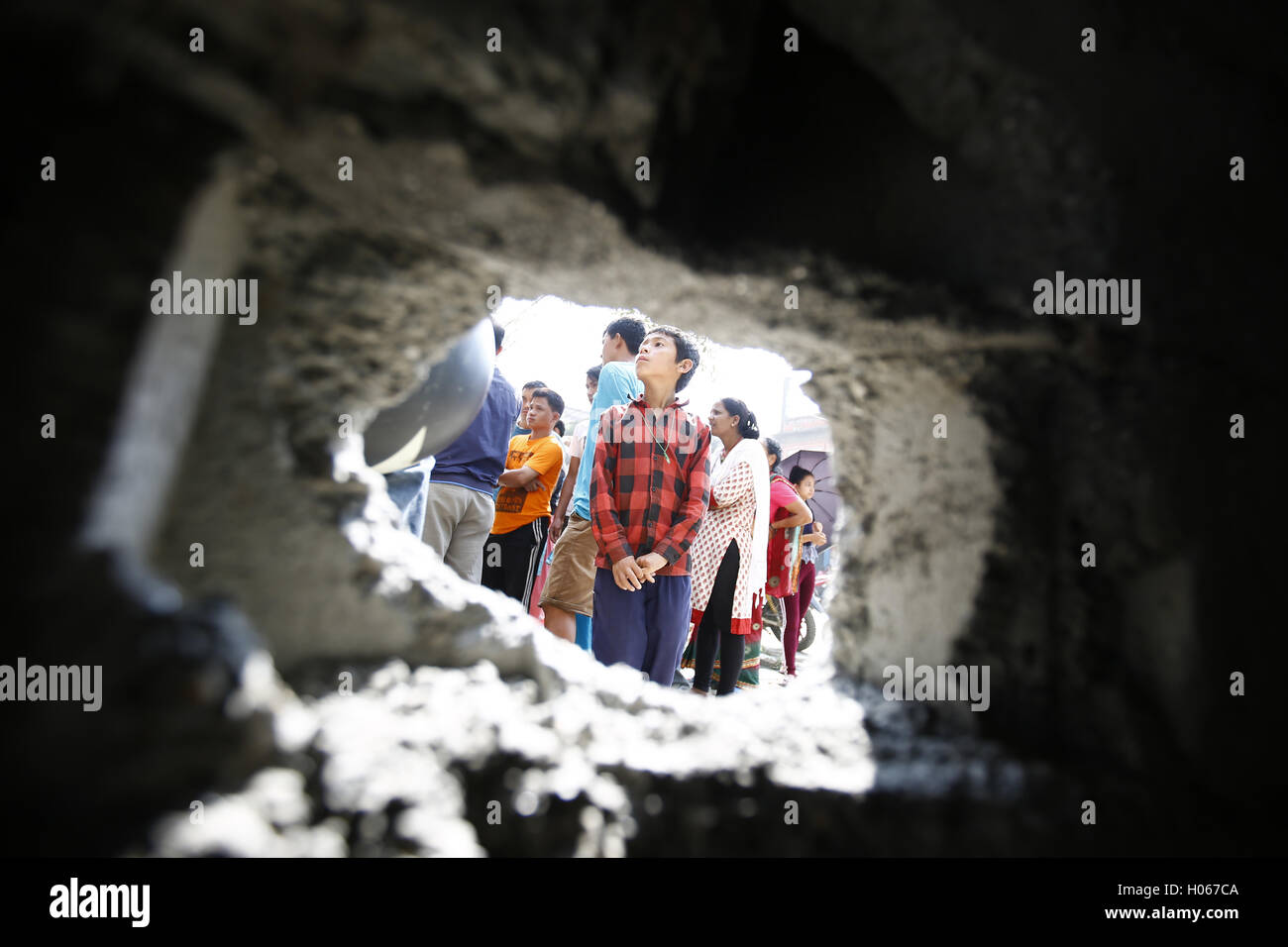 Kathmandu, Nepal. 20th Sep, 2016. Nepalese people gather around the ...