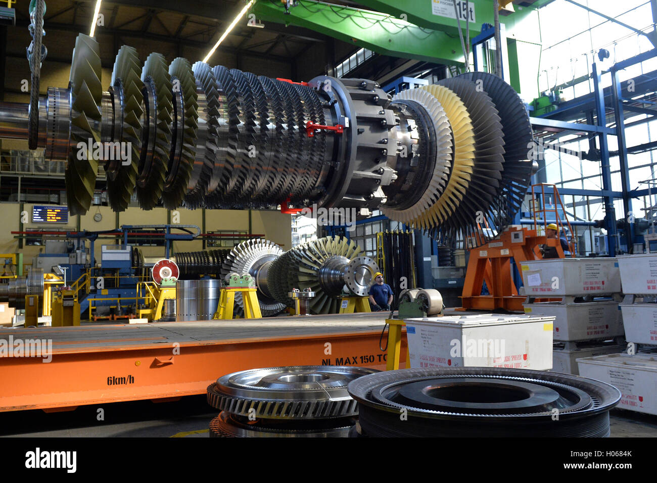 Siemens workers monitor a turbine rotor in a gas turbine in Berlin ...