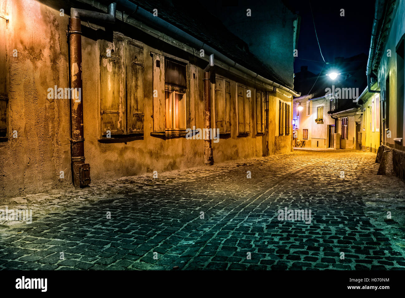 Dark deserted alley by night, in Sibiu, Romania (hollywood effect ...
