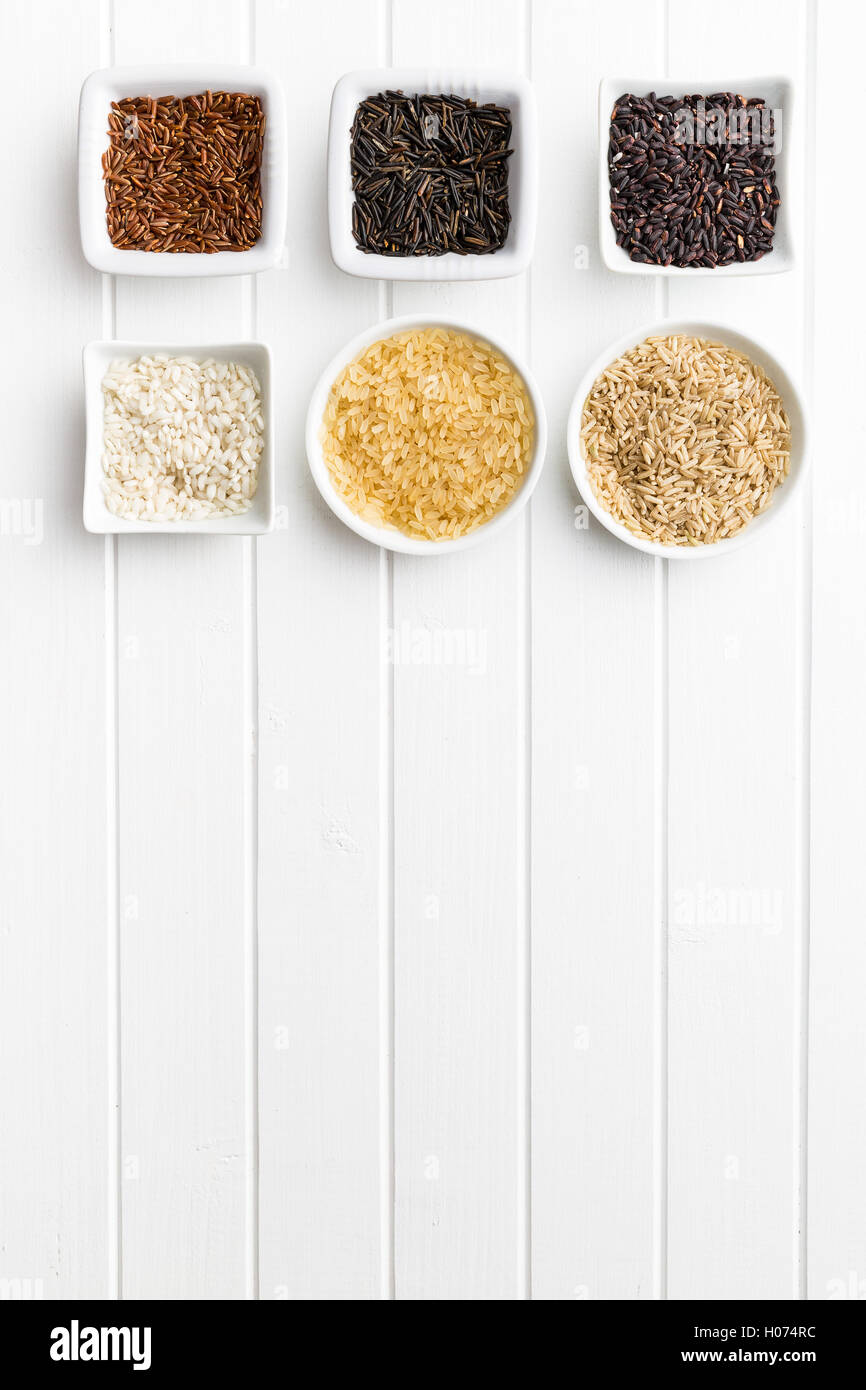 Different rice varieties on kitchen table. Top view Stock Photo - Alamy