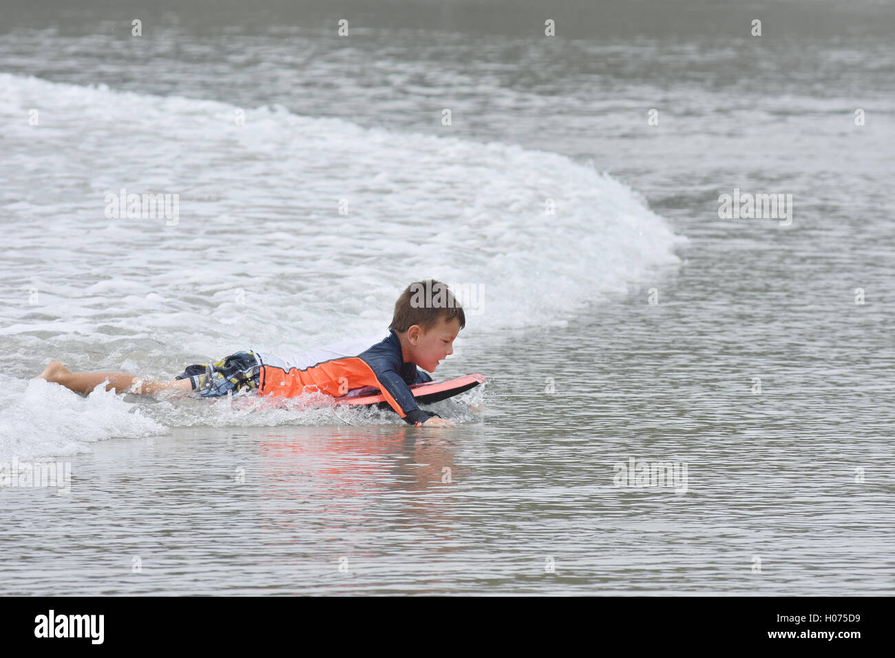 Small boy on bodyboard Stock Photo - Alamy