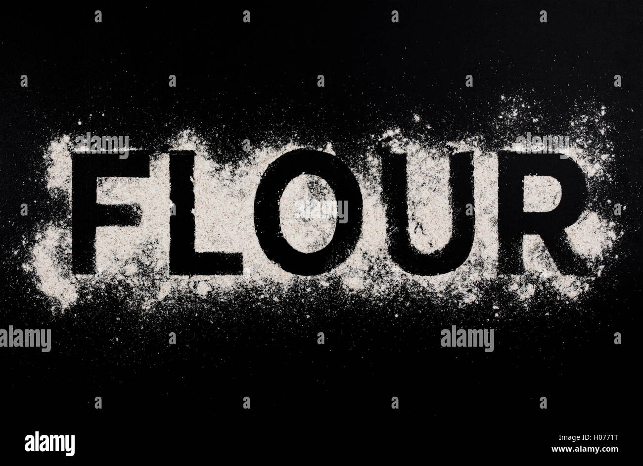 Word flour made from white flour on a dark table Stock Photo - Alamy