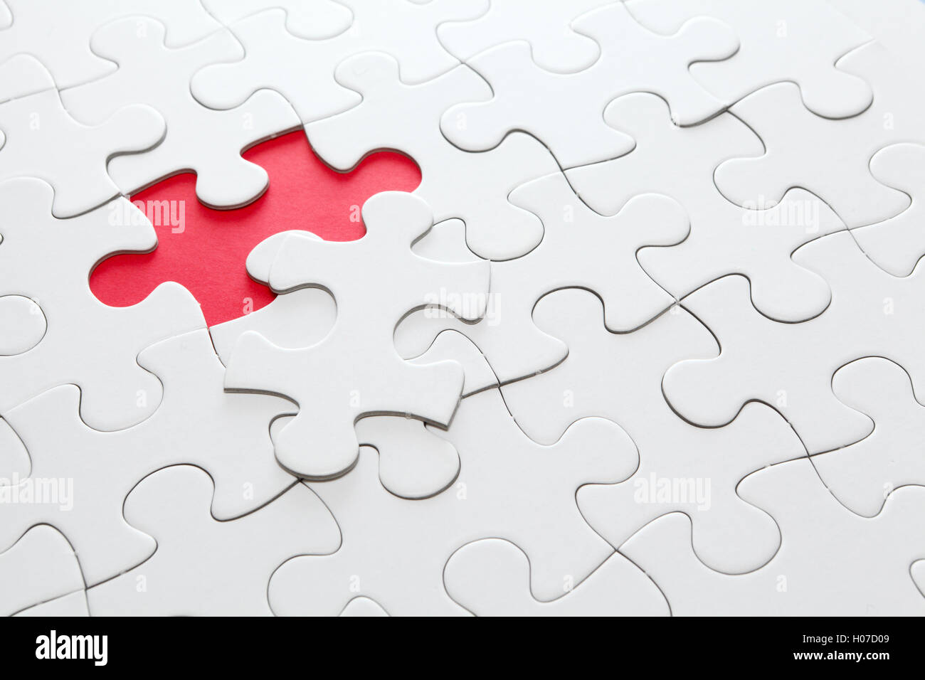 Missing piece in red color Stock Photo - Alamy