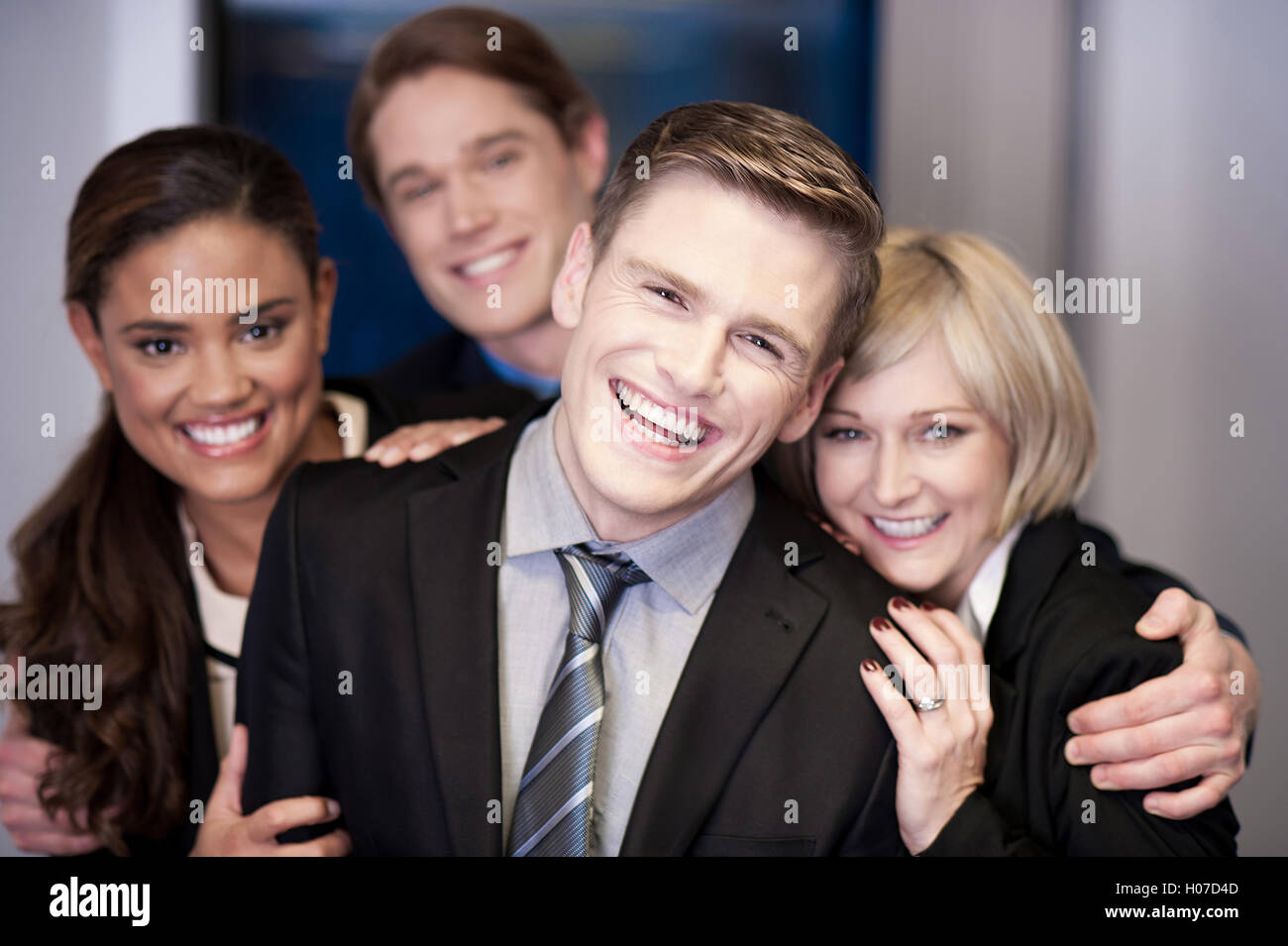 Business team of four having fun at work Stock Photo - Alamy