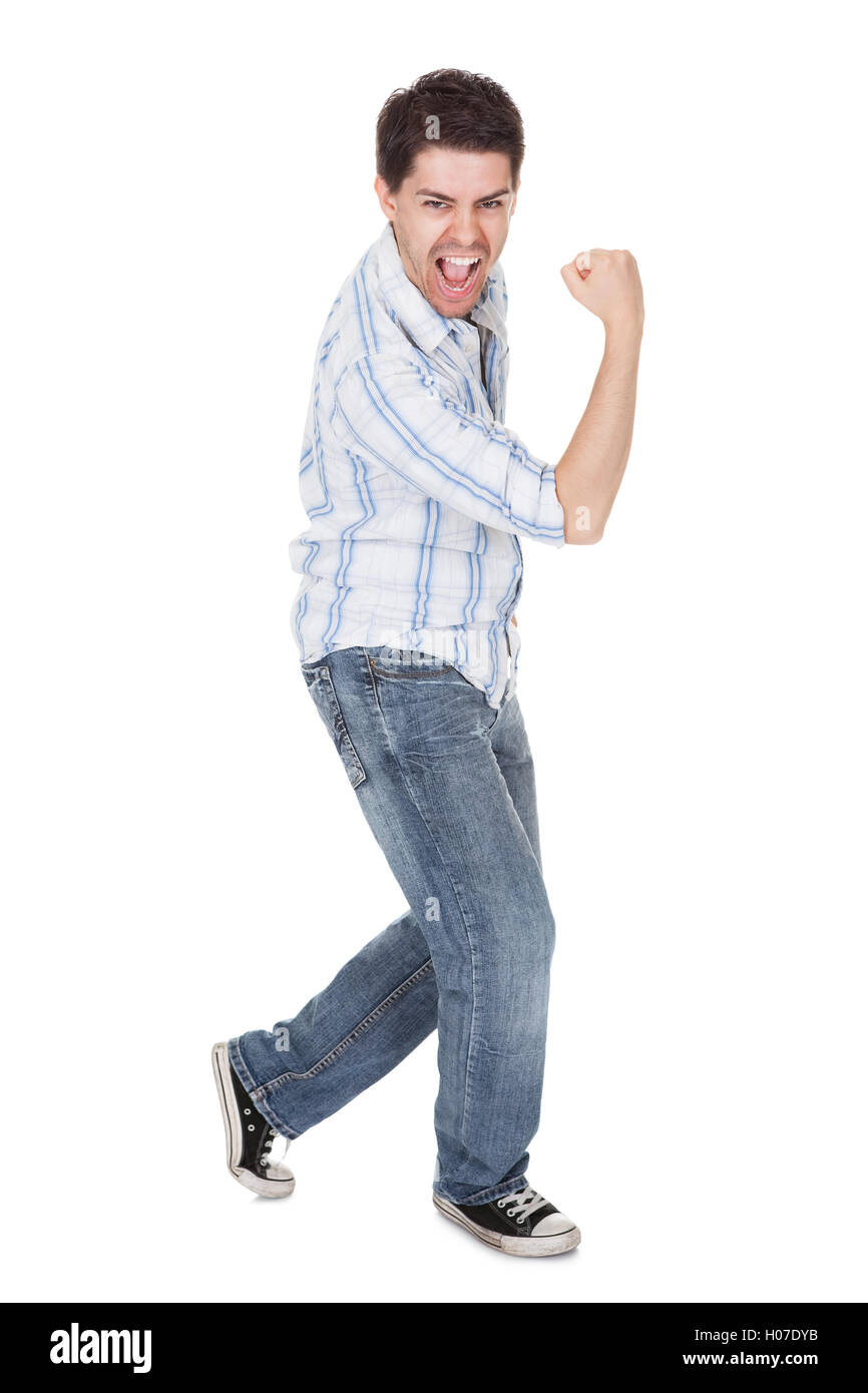 Casual man shouting for joy Stock Photo - Alamy