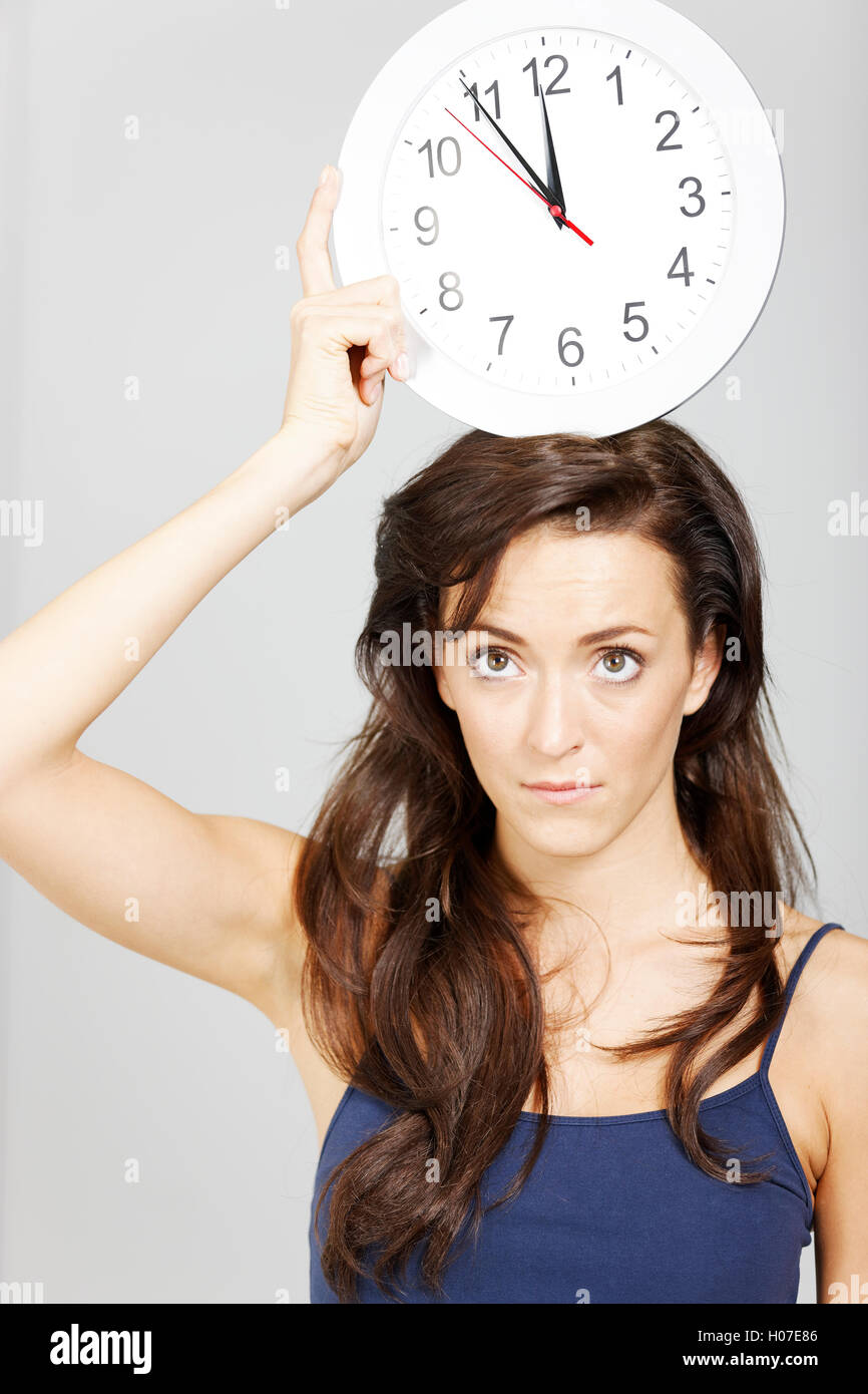 Woman with clock Stock Photo - Alamy