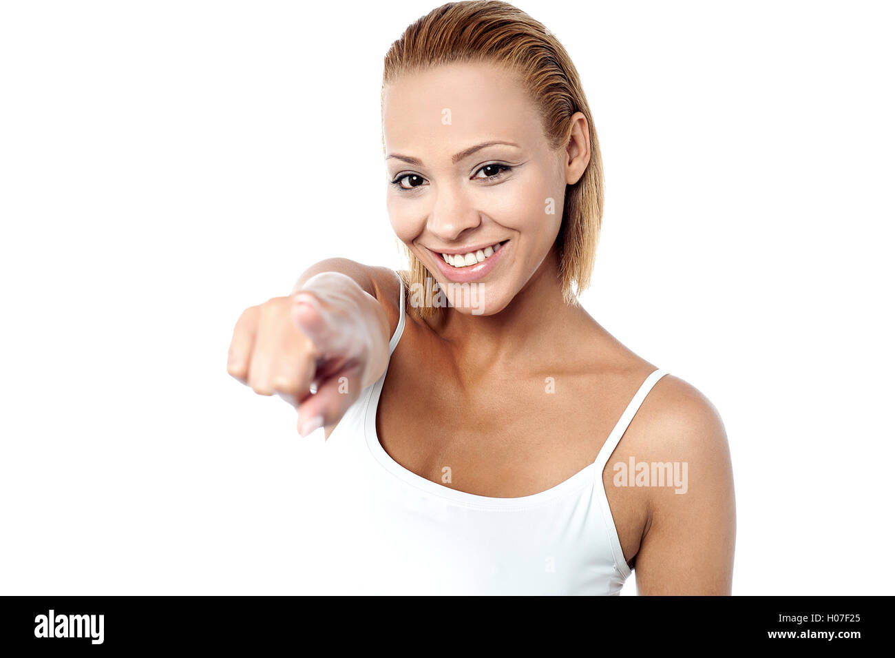Smiling young female pointing you out Stock Photo - Alamy