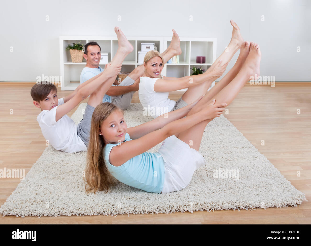 Family Doing Stretching Exercises Stock Photo - Alamy