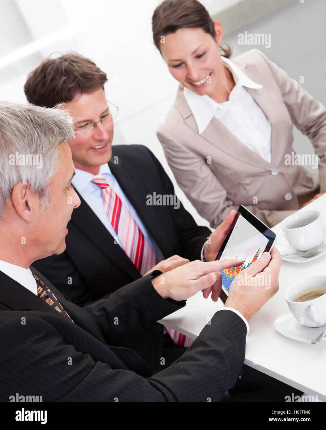 Business colleagues enjoying a coffee break Stock Photo - Alamy