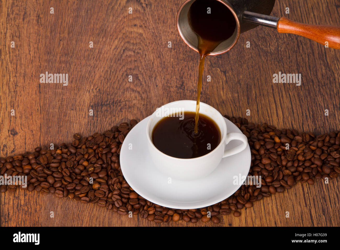 Pouring coffee in cup Stock Photo - Alamy