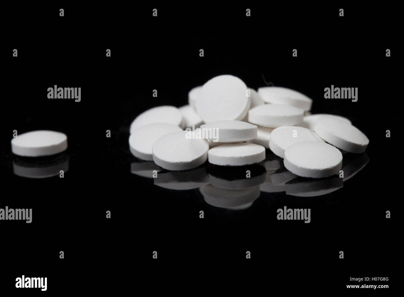 Small round pills, made of chemical substances Stock Photo - Alamy