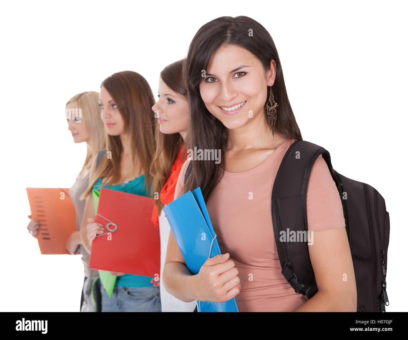 Four female students in a row Stock Photo - Alamy