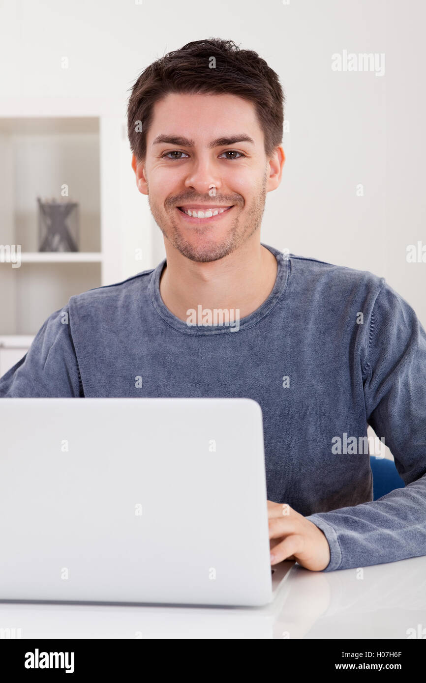 Happy caucasian man smiling using hi-res stock photography and images ...