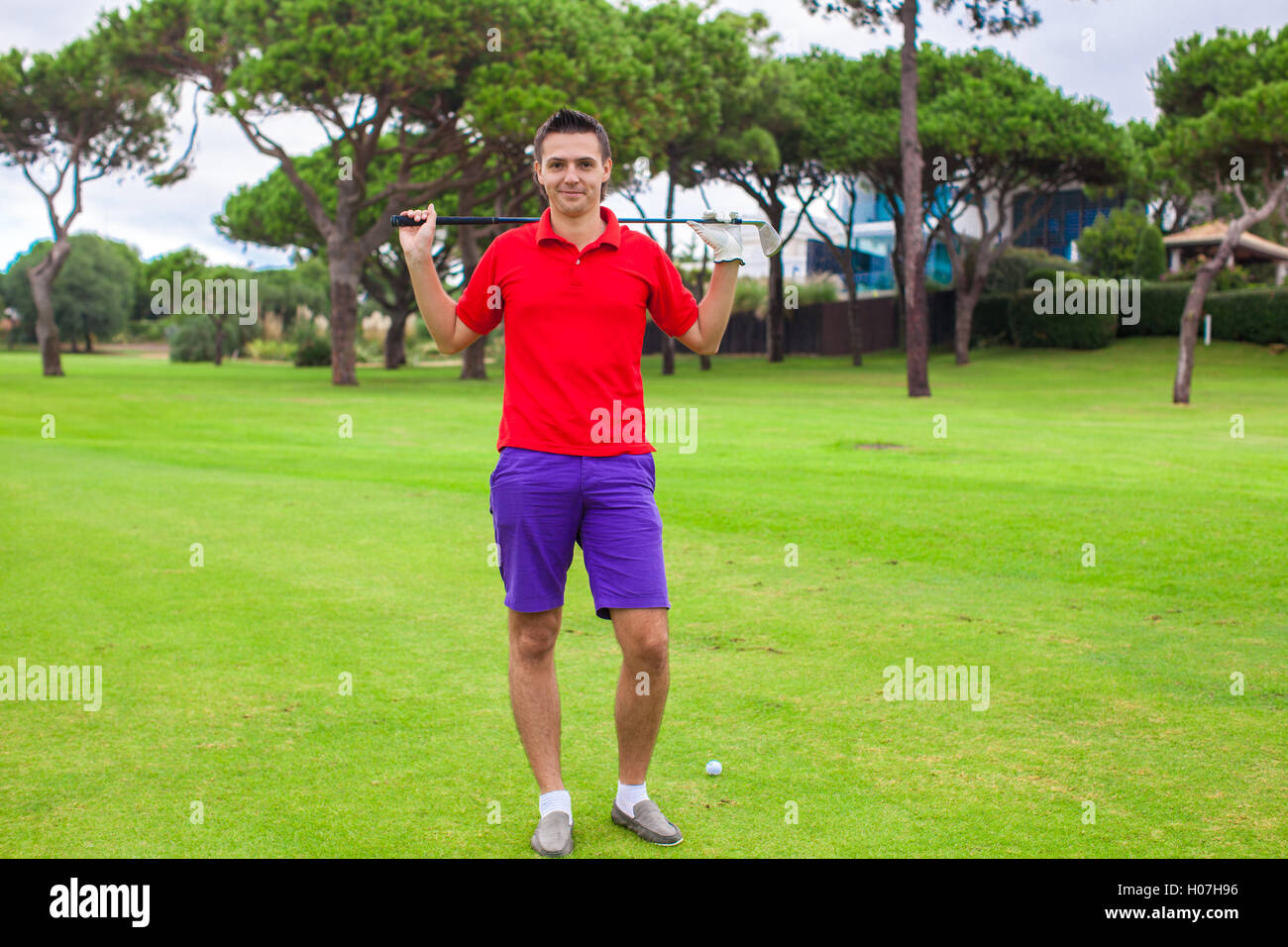 Young man on the golf course Stock Photo - Alamy