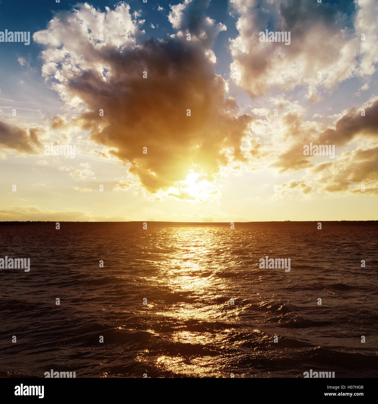 orange color sea on sunset Stock Photo - Alamy