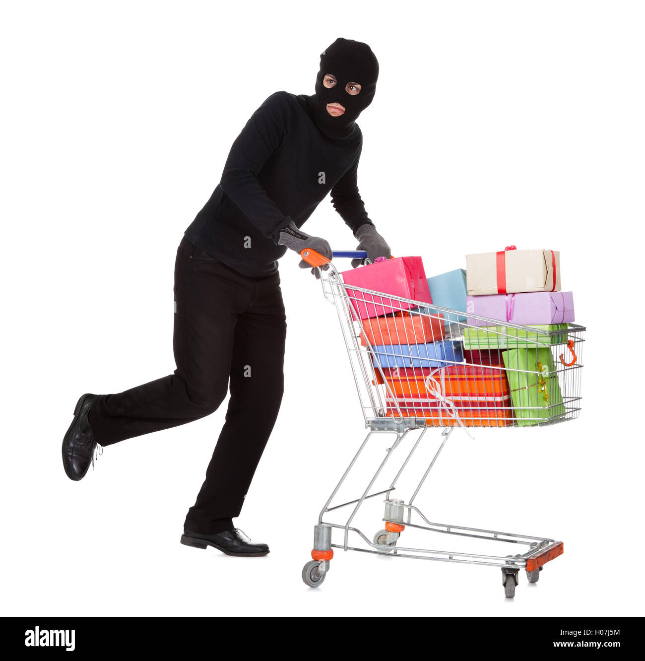 Thief pushing a trolley of gifts Stock Photo - Alamy