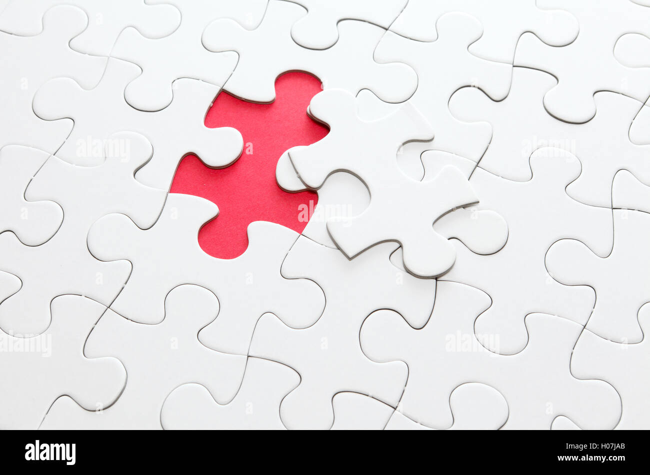 Incomplete puzzle with missing piece Stock Photo - Alamy
