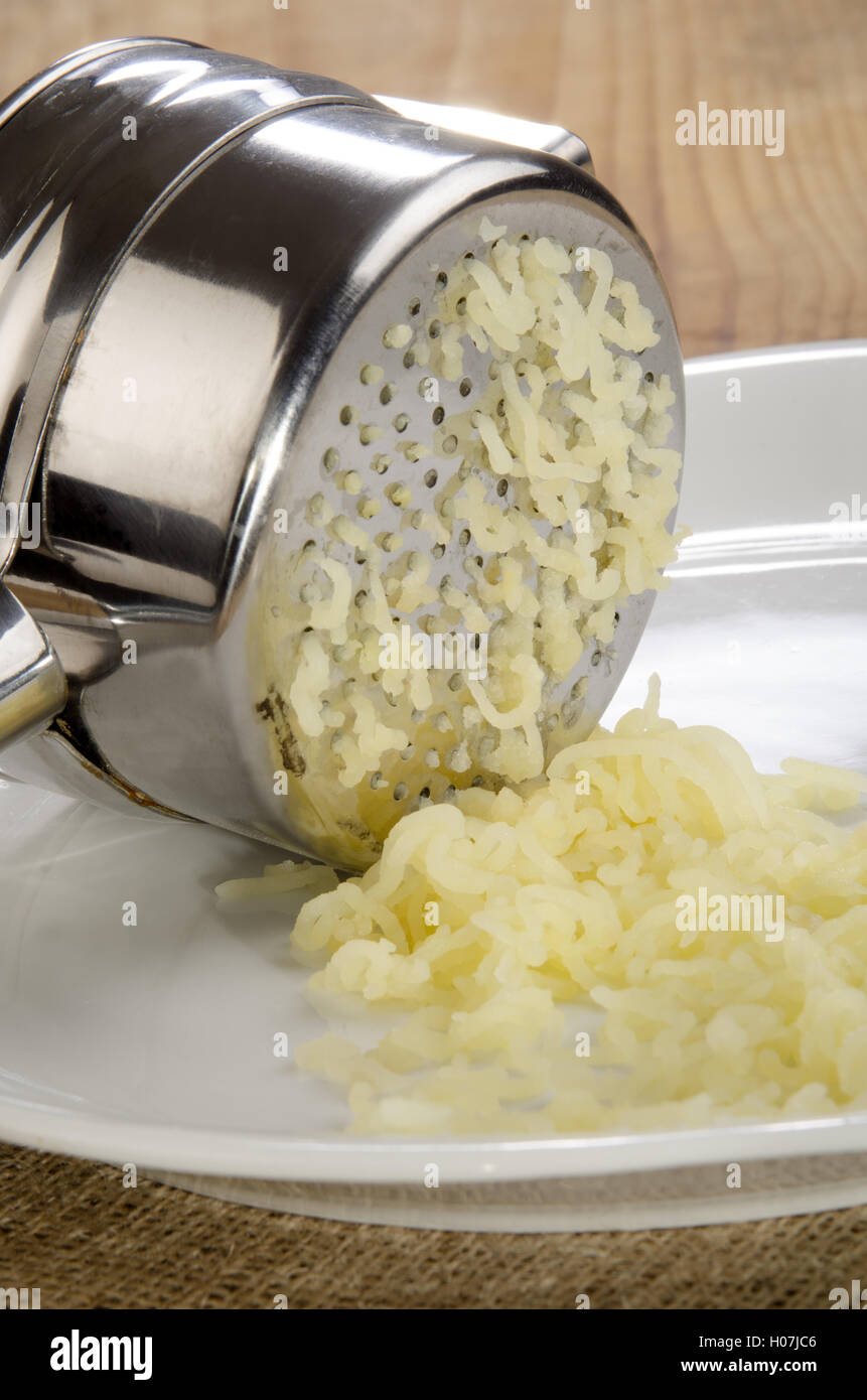 potatoes are prepared in a potato press Stock Photo - Alamy