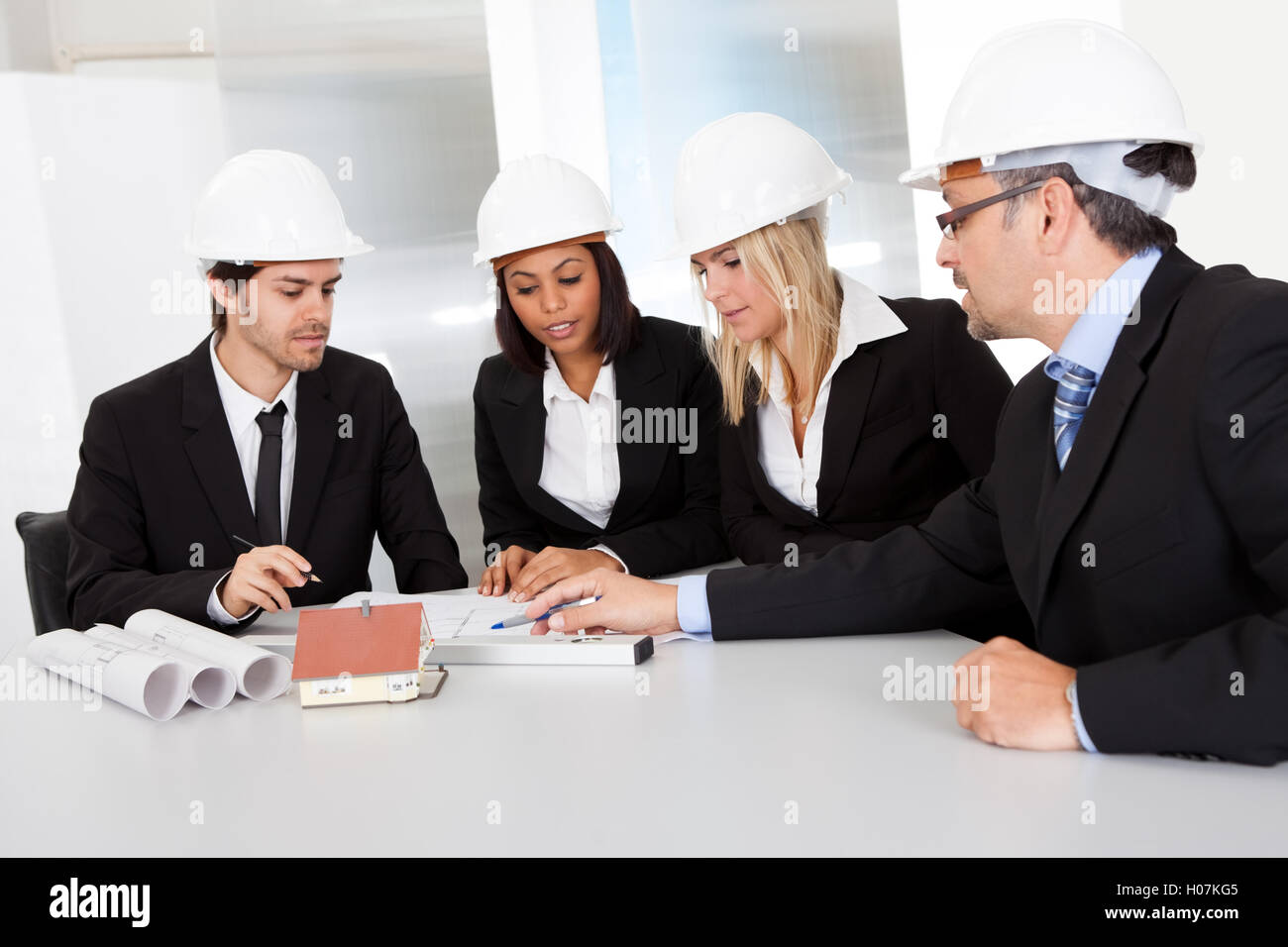 Group of architects at the meeting Stock Photo - Alamy