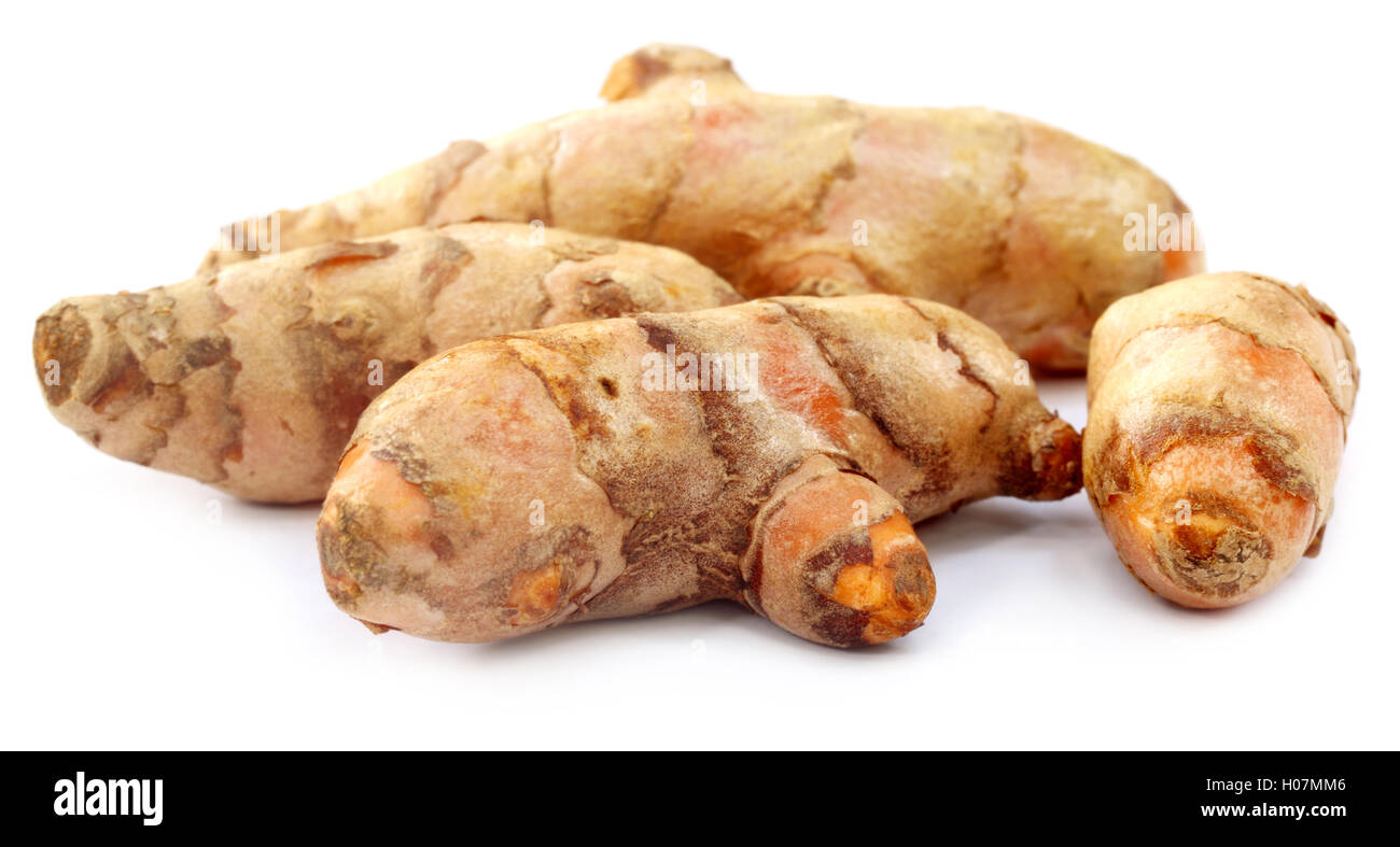 Raw Turmeric over white background Stock Photo - Alamy
