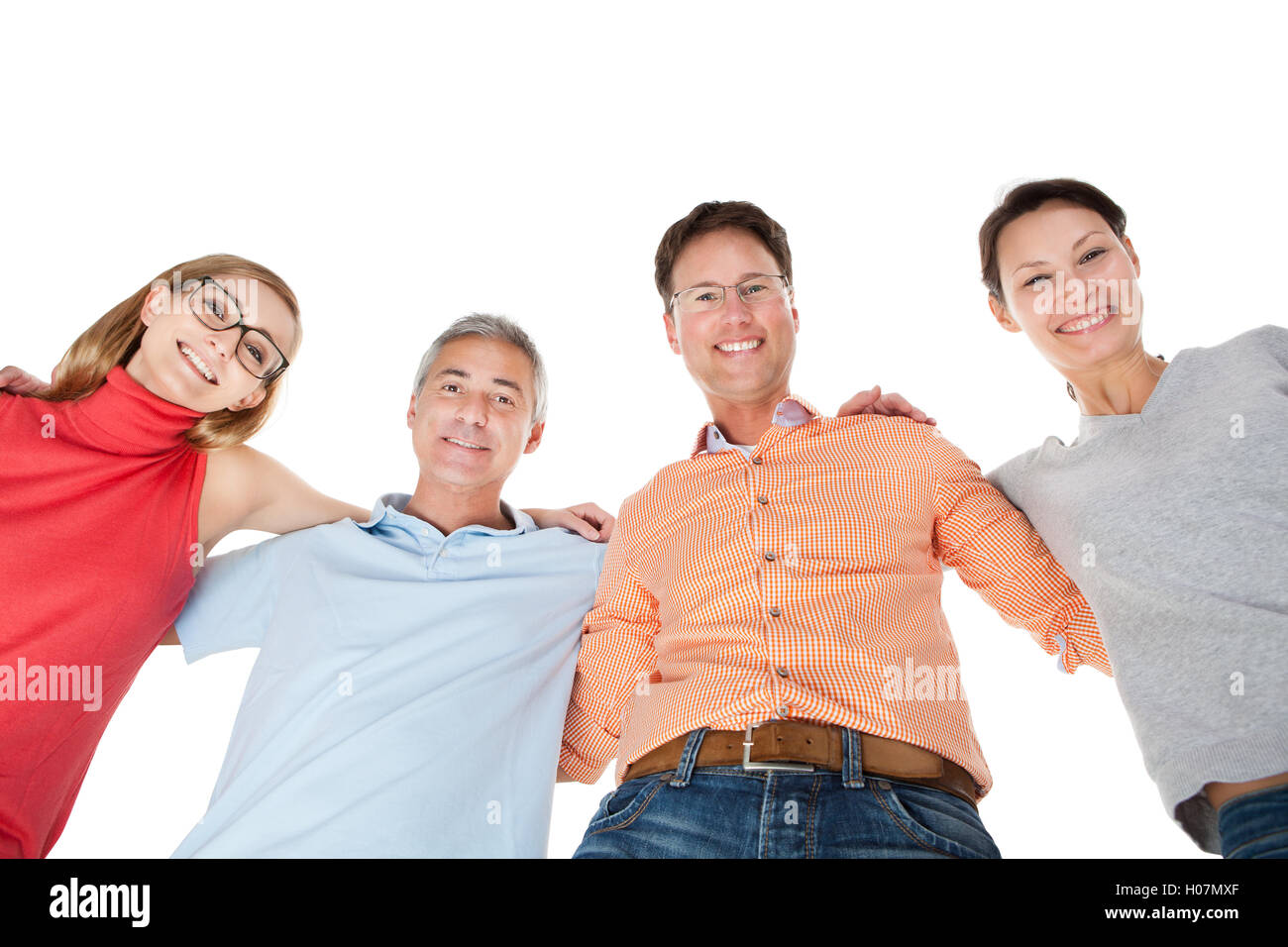 Two happy couples looking down Stock Photo - Alamy