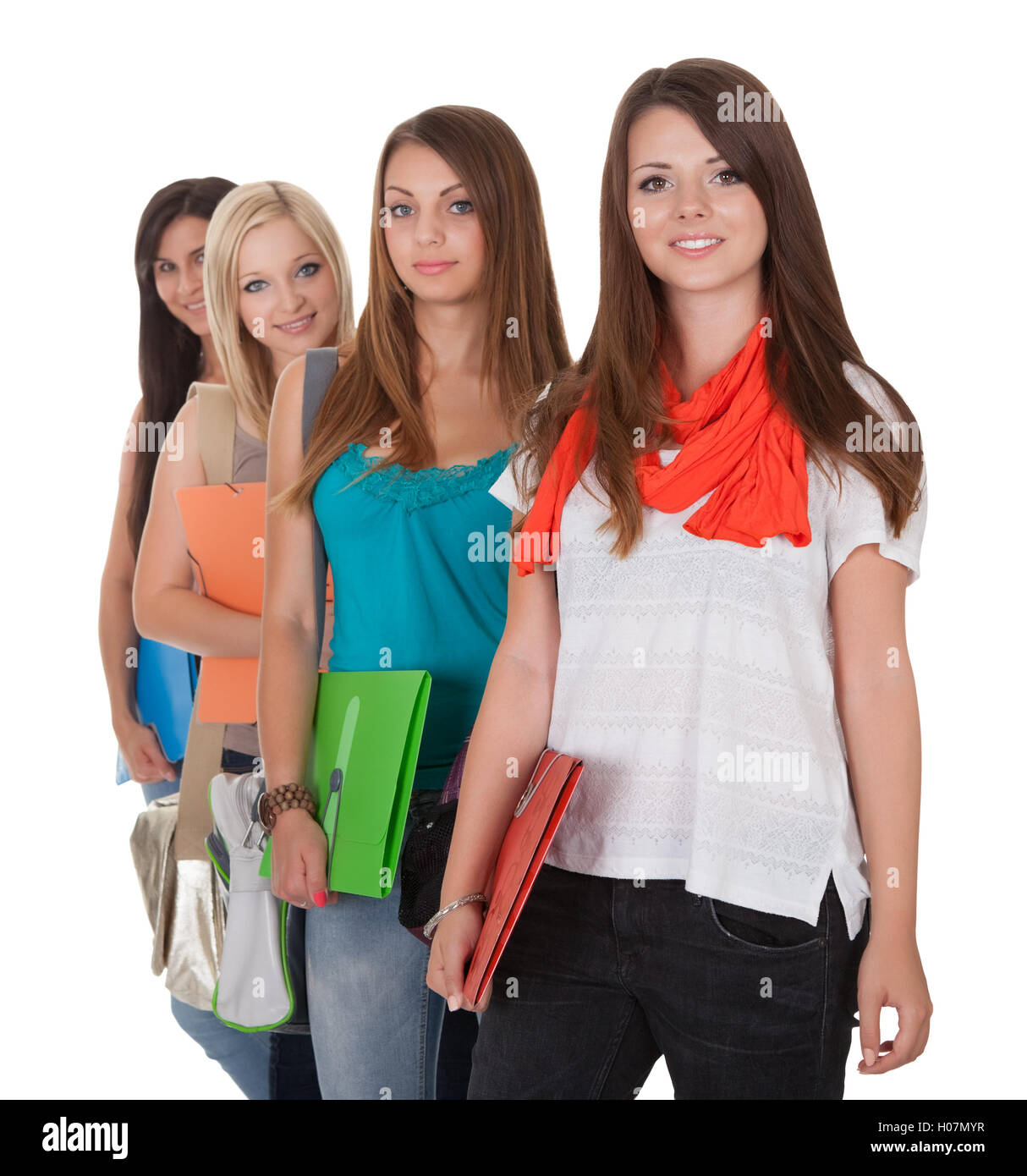 Four female students in a row Stock Photo - Alamy