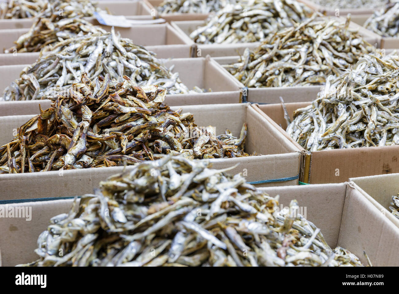 Dried small anchovy fish in the paper box Stock Photo - Alamy