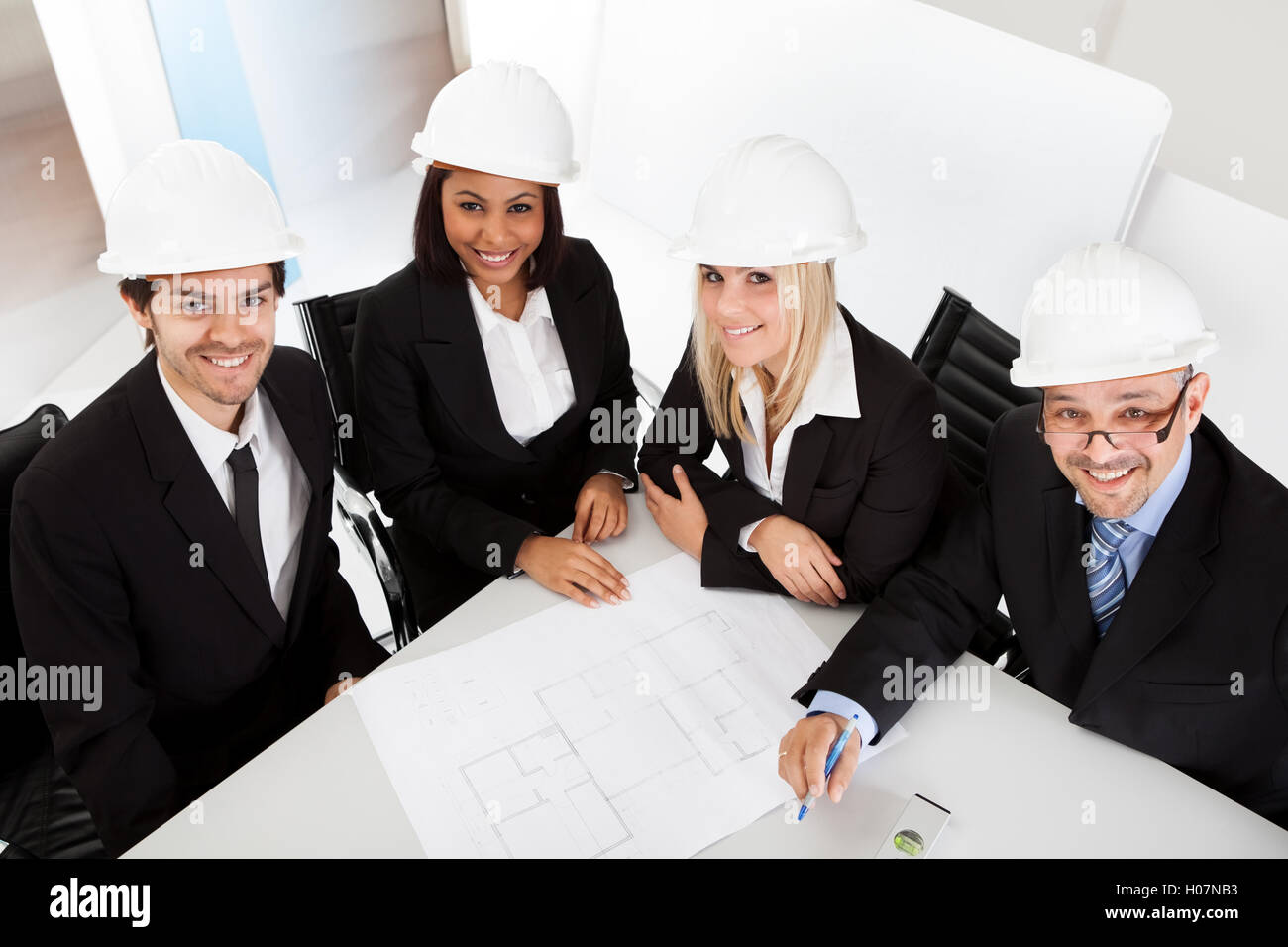 Group of architects at the meeting Stock Photo - Alamy