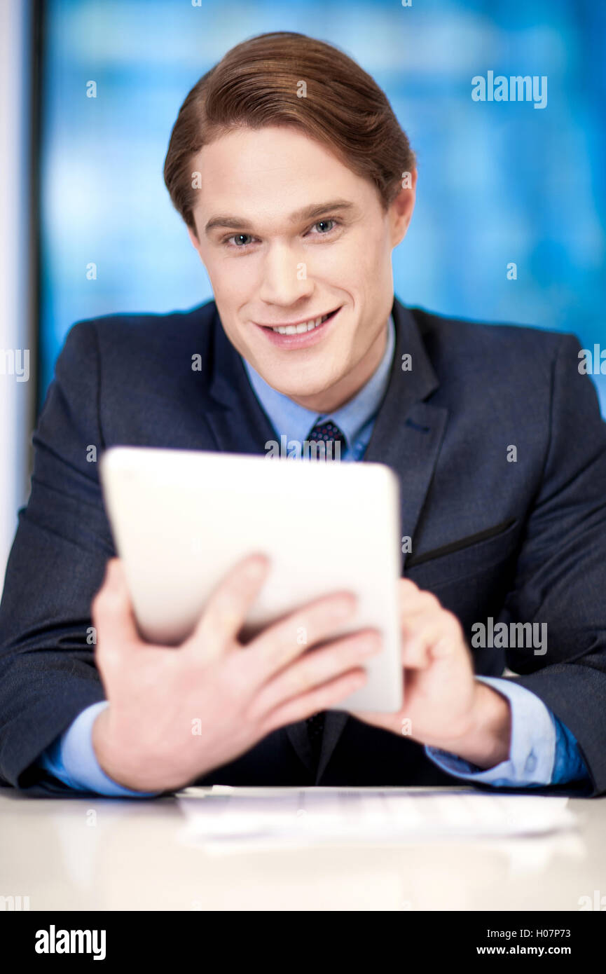 Corporate guy browsing on tablet pc Stock Photo - Alamy