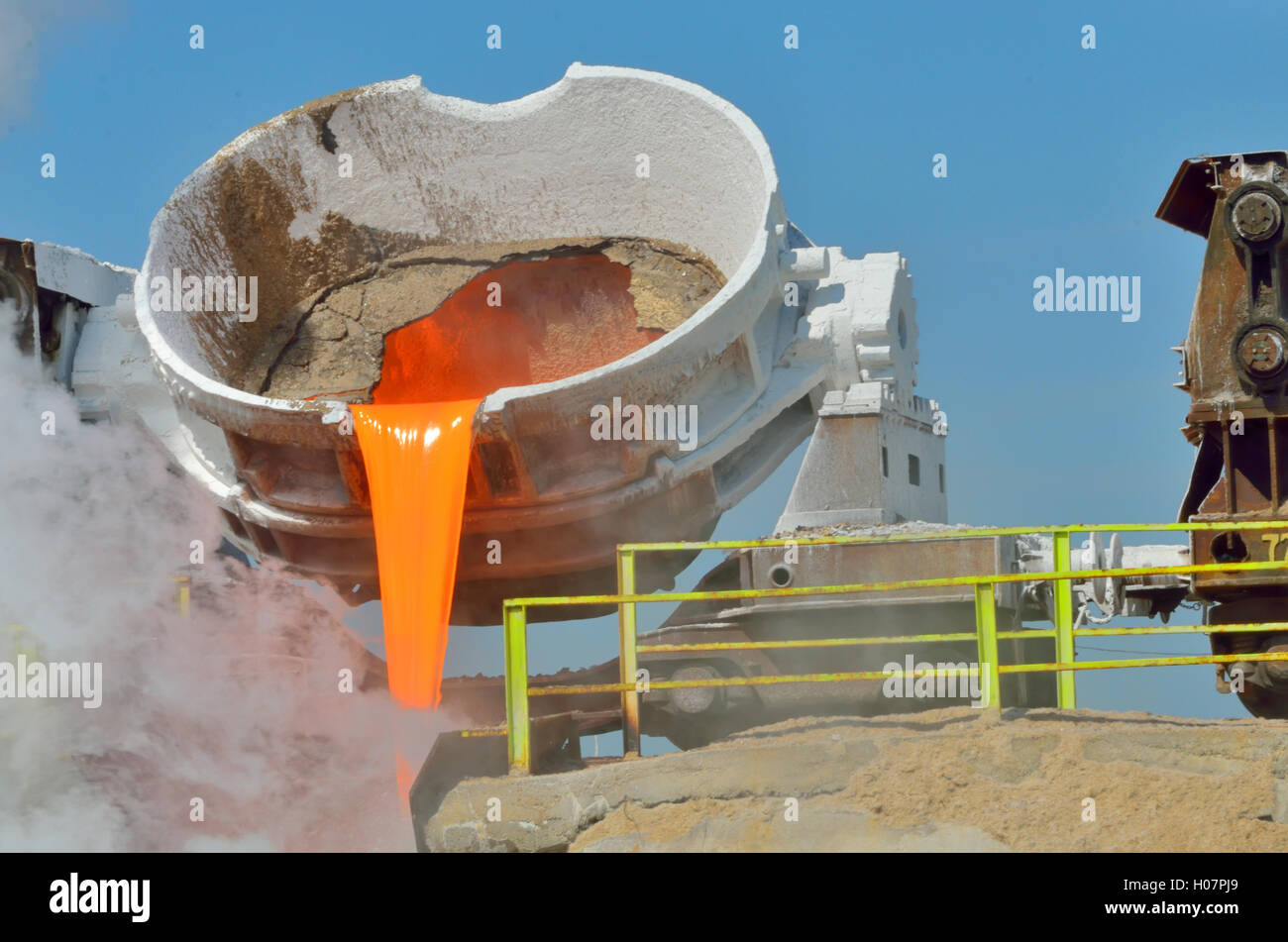The molten slag is poured from a cup Stock Photo - Alamy
