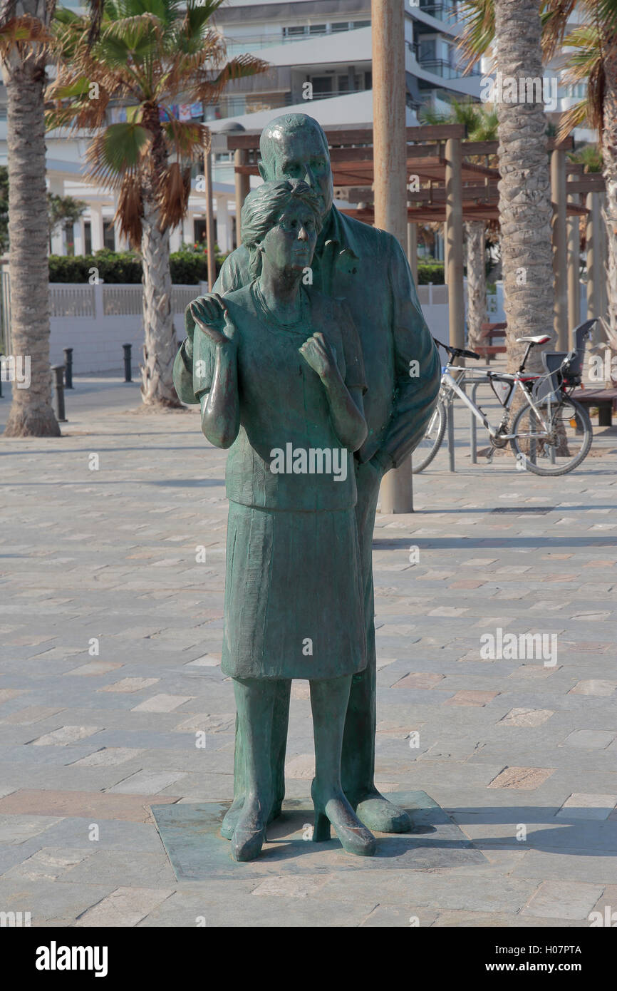 bronze statue of two elderly looking into infinity Stock Photo - Alamy