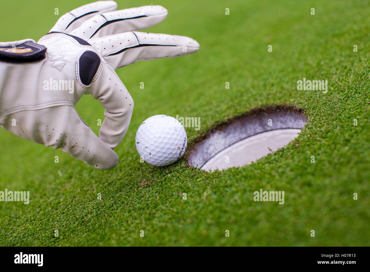 Man push ball in golf hi-res stock photography and images - Alamy
