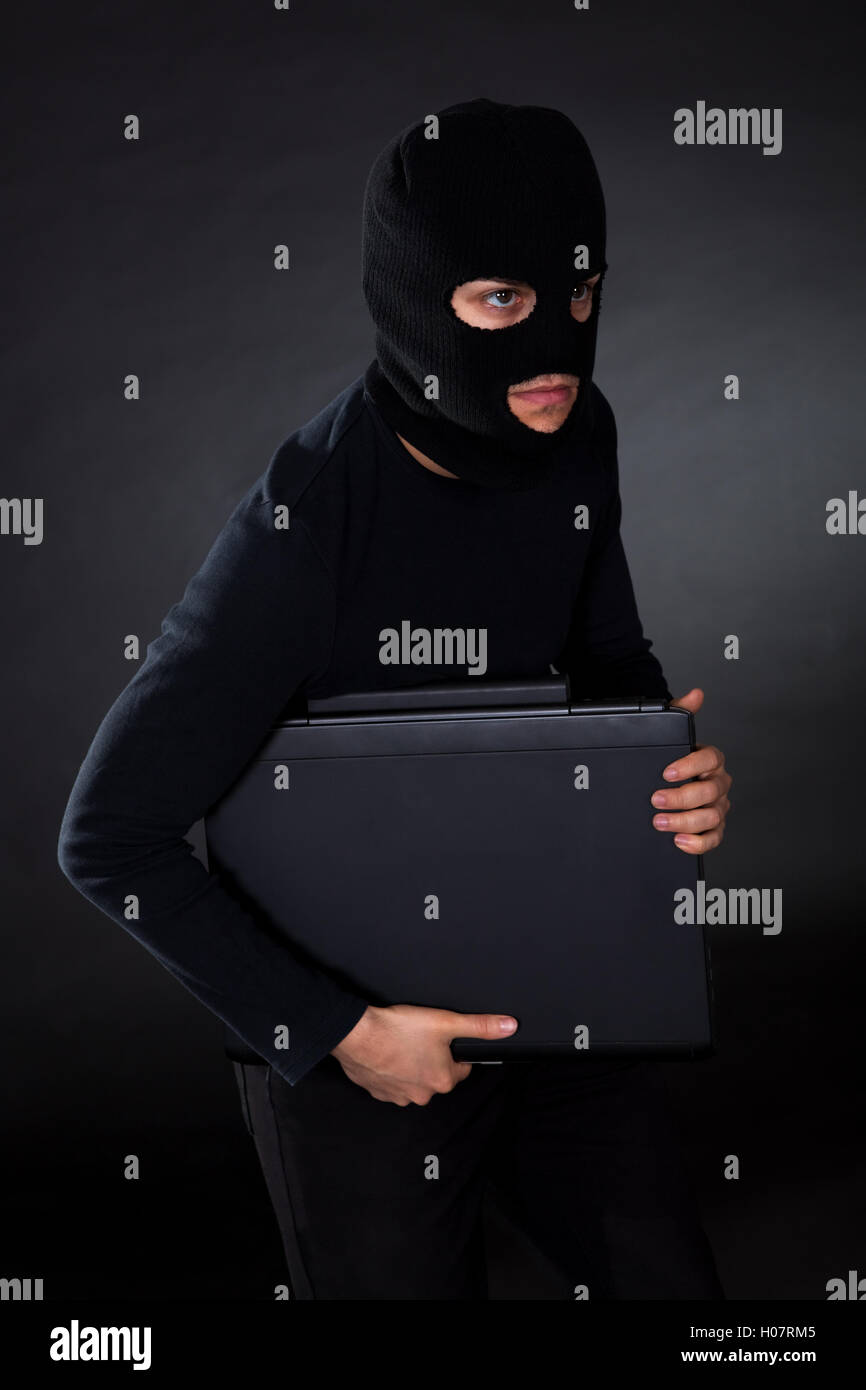 Burglar on Computer Stock Photo - Alamy