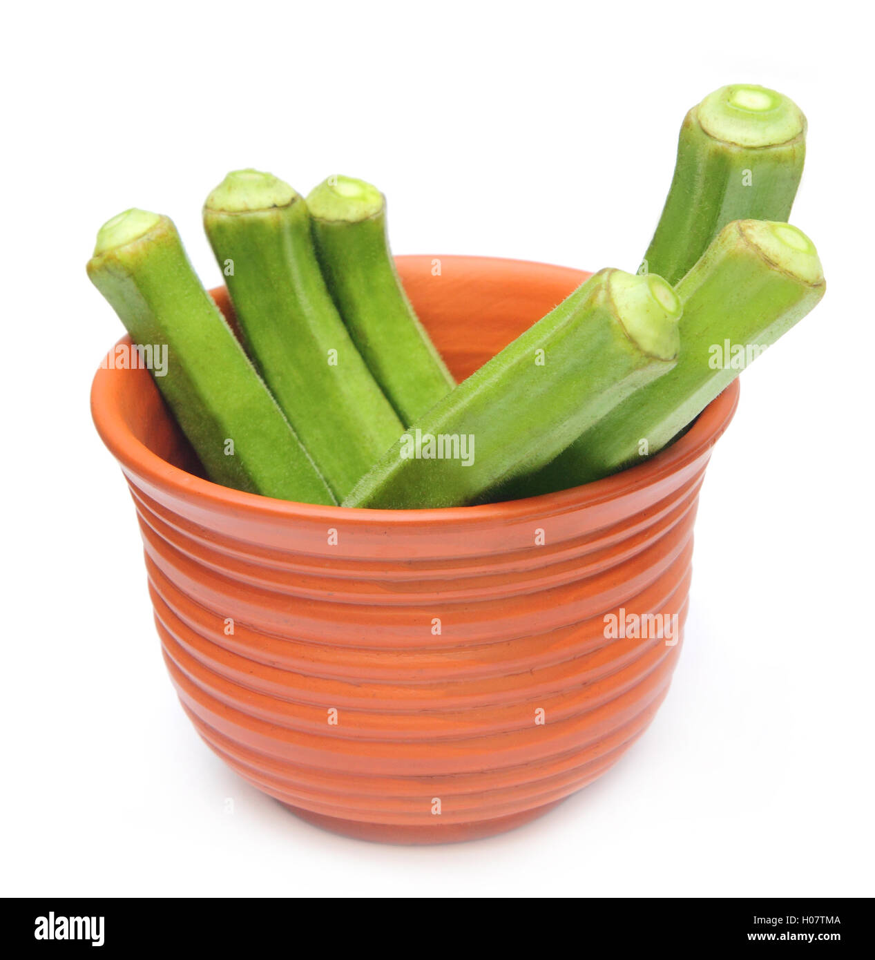 Okras on a brown bowl Stock Photo - Alamy