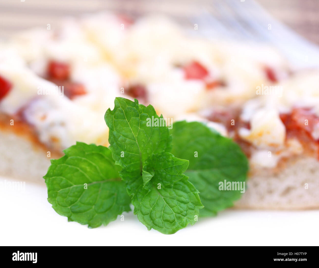 Pizza with mint leaves Stock Photo - Alamy