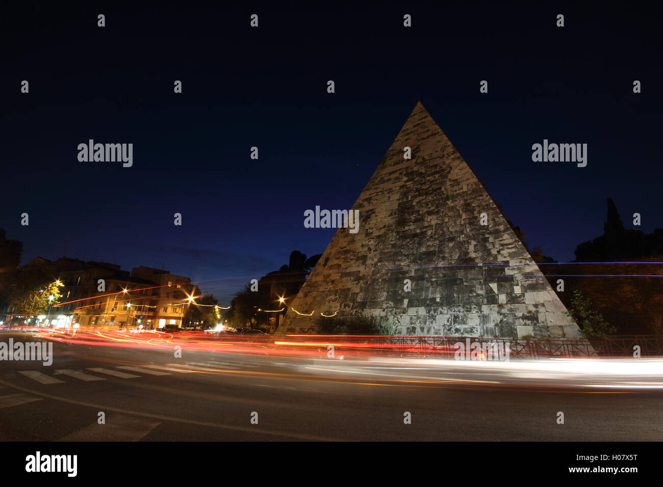 a stunning shot of the Egyptian style pyramid in the city of Rome by ...
