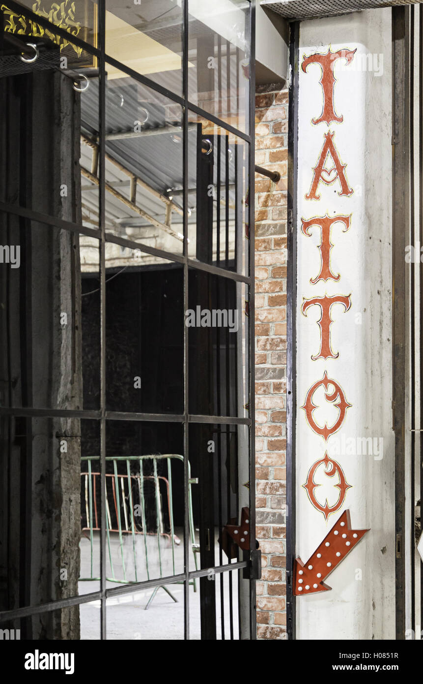 Signal a tattoo, detail of a cartel Stock Photo - Alamy