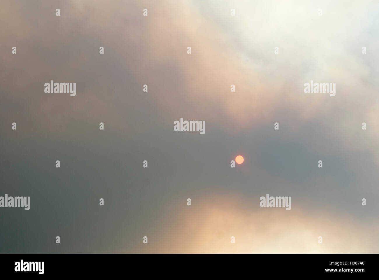 Sun seen through smoke from forest fire in Colorado mountains Stock ...