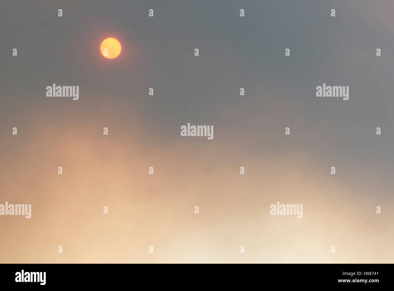 Sun seen through smoke from forest fire in Colorado mountains Stock ...