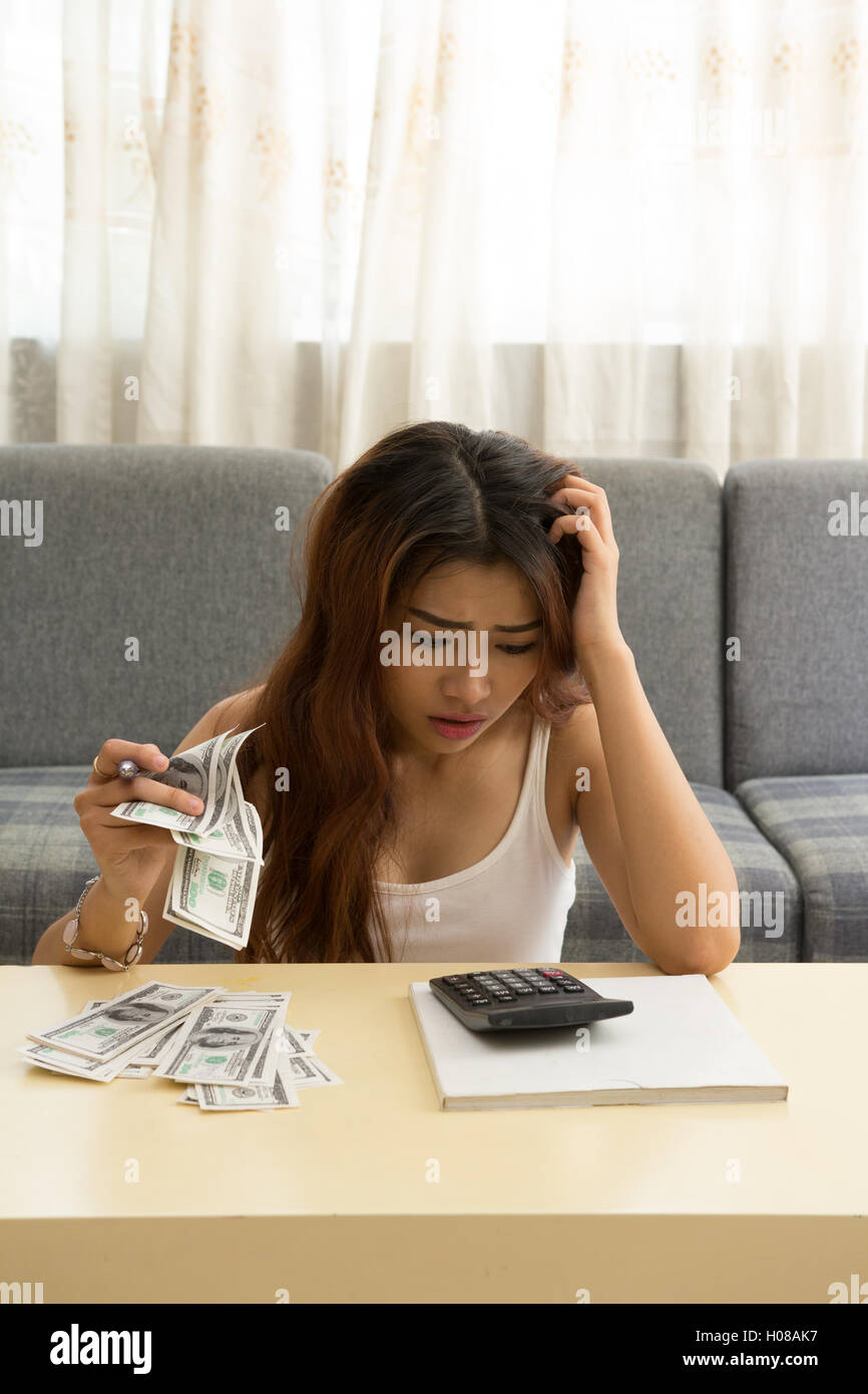 Asian Woman working on finances Stock Photo - Alamy