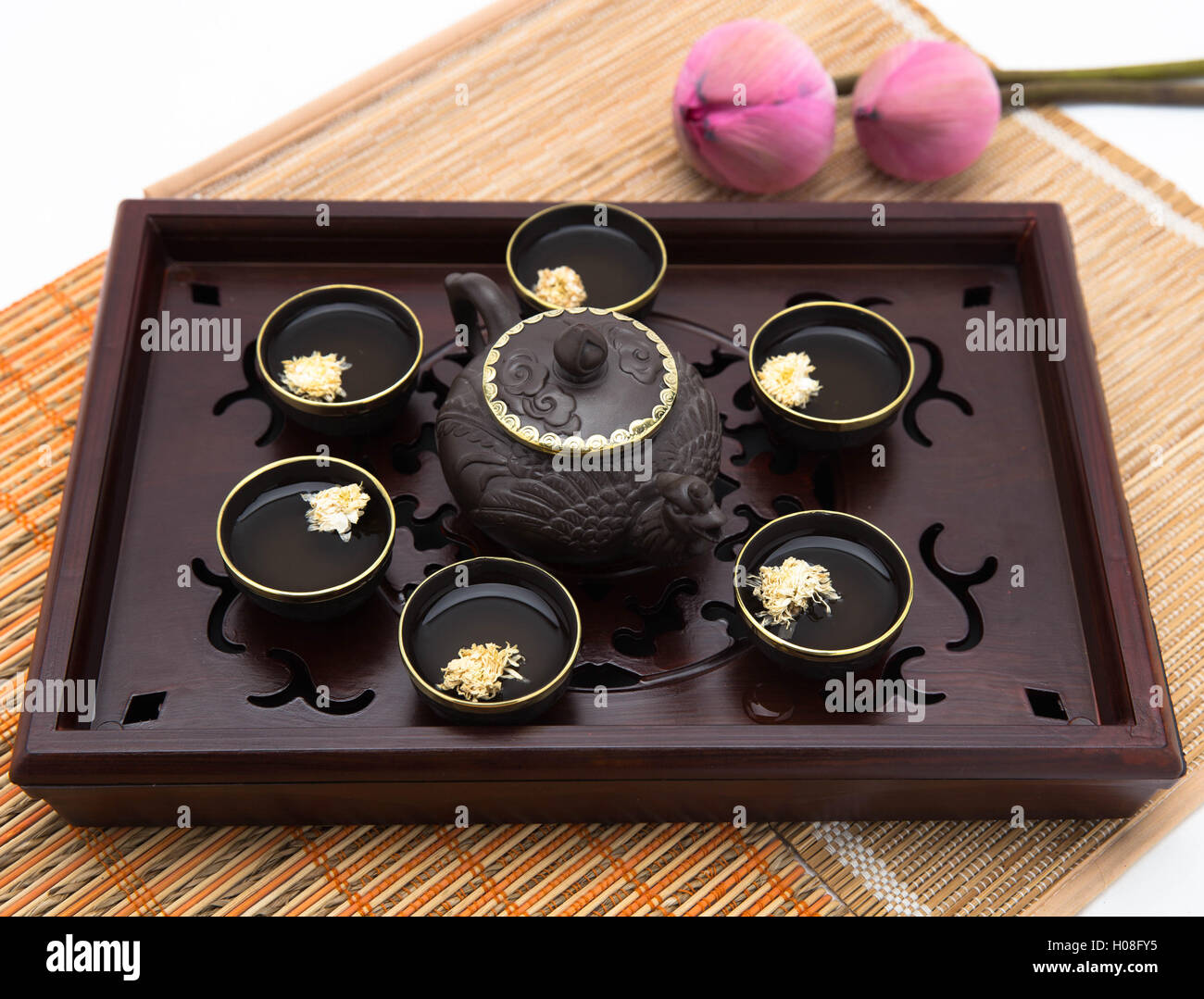 Black tea cups with lotus Stock Photo - Alamy