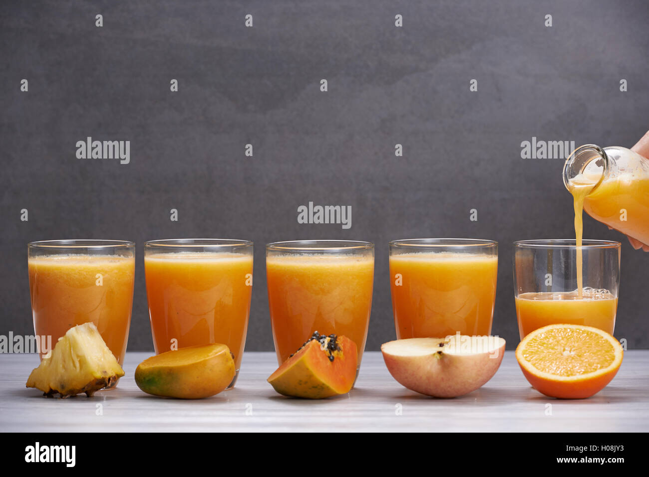 Fruit juices from pineapple, papaya, orange, mango and apple Stock ...