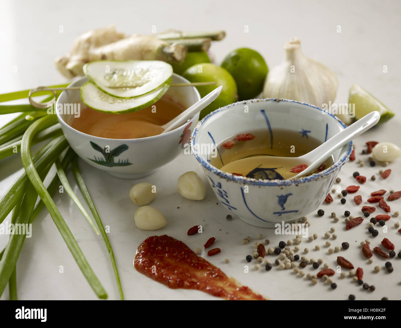 Fish sauce with spices on white background Stock Photo - Alamy