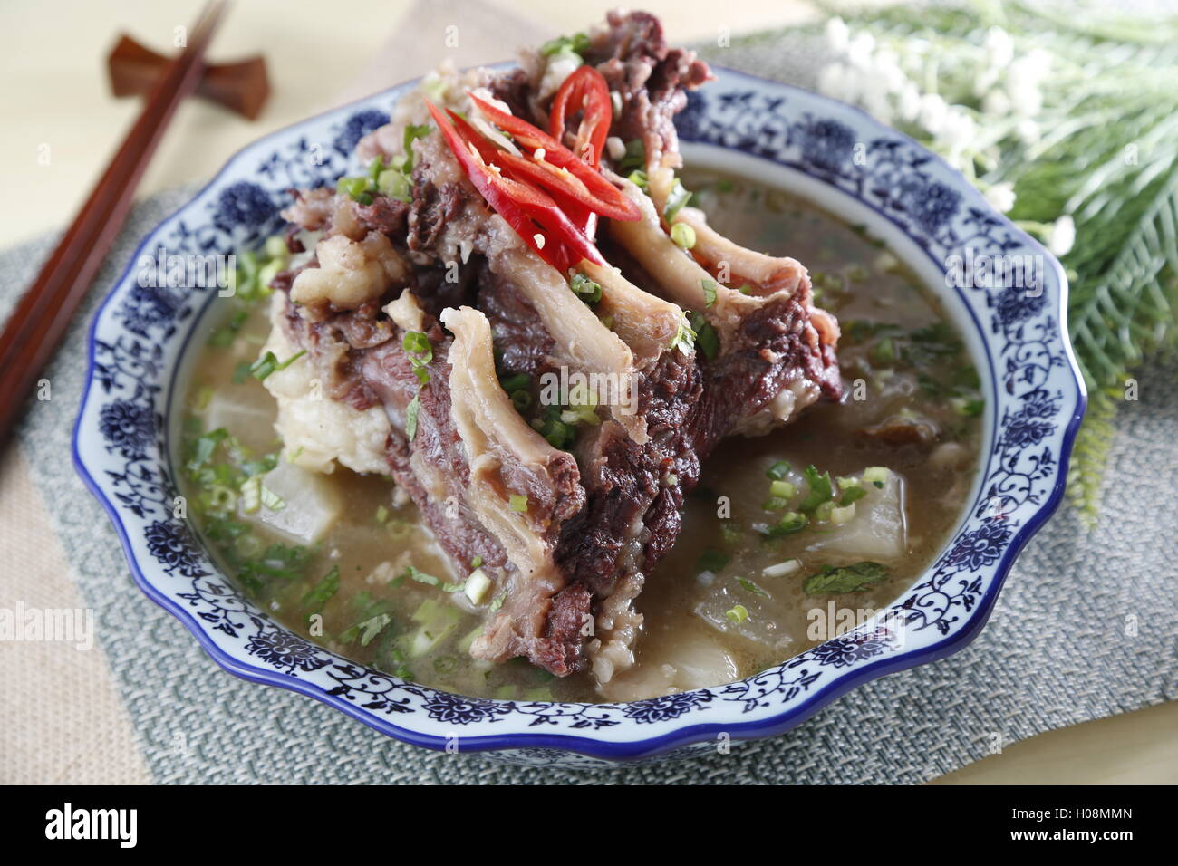 Traditional chinese bowl of pork ribs soup on the table in restaurant ...