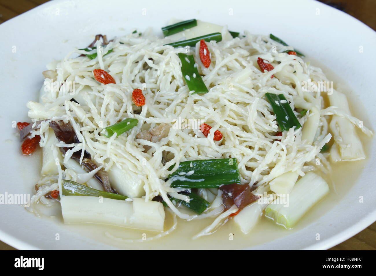 Fried bamboo shoots with lotus Stock Photo - Alamy