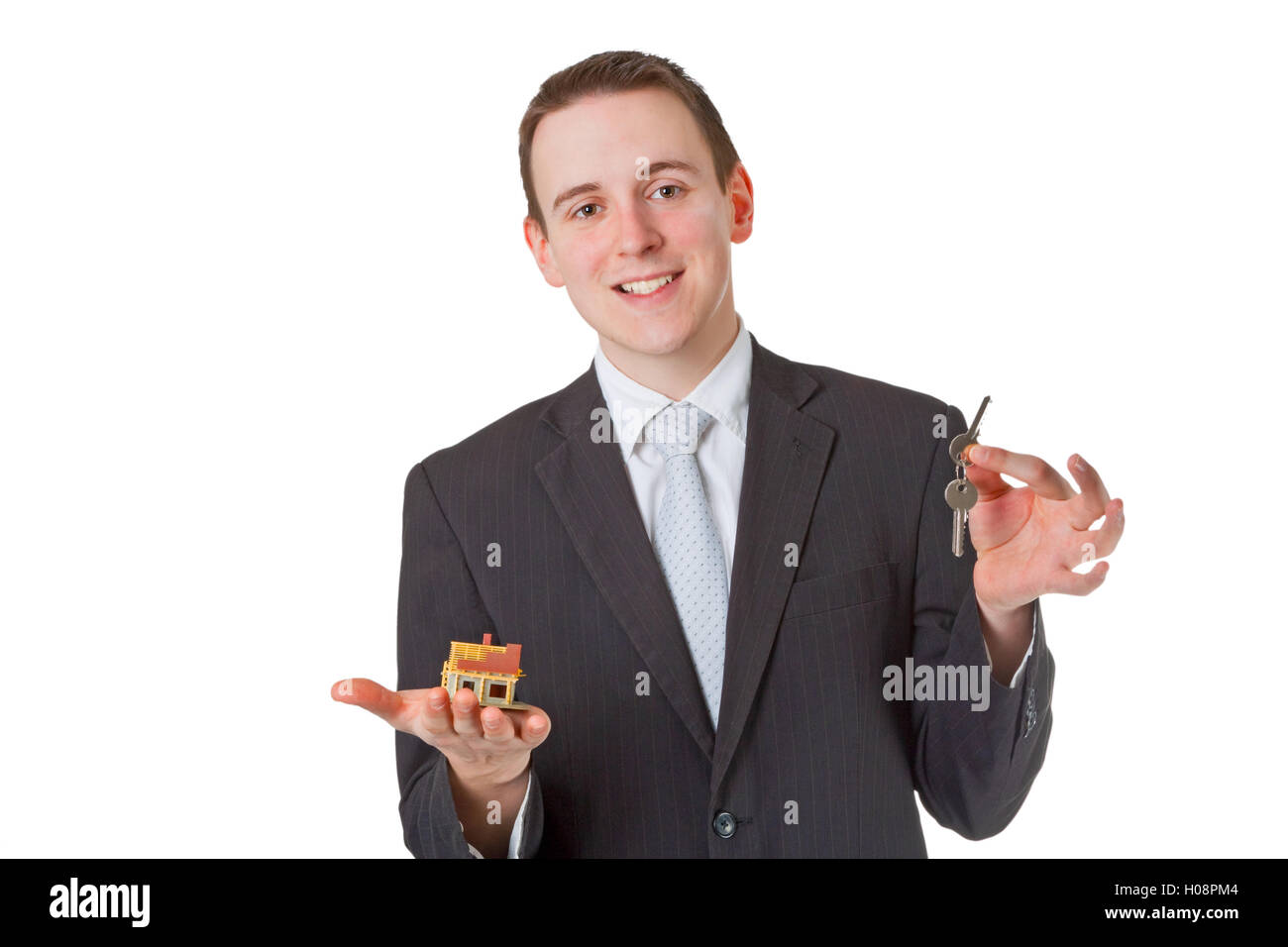 Friendly real estate agent isloated on white background Stock Photo - Alamy