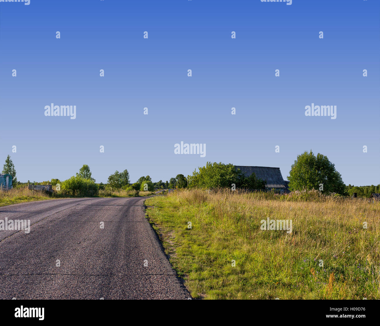 Landscape with road and blue sky Stock Photo - Alamy