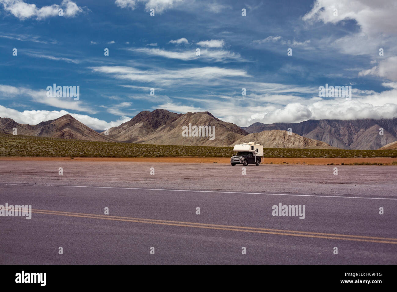 4x4 AWD RV motorhome adventure camper on the side of the road next to a ...