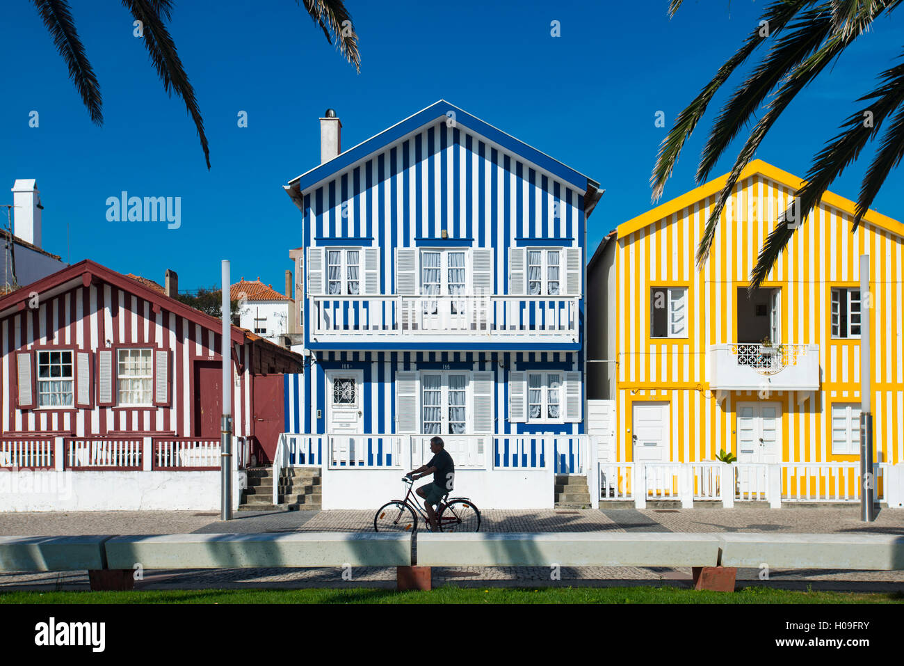 Colourful stripes decorate traditional beach house style on houses in ...