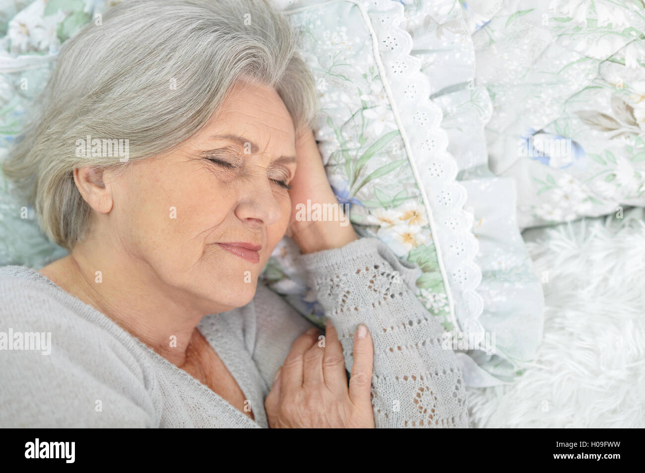 Senior woman in bed Stock Photo - Alamy